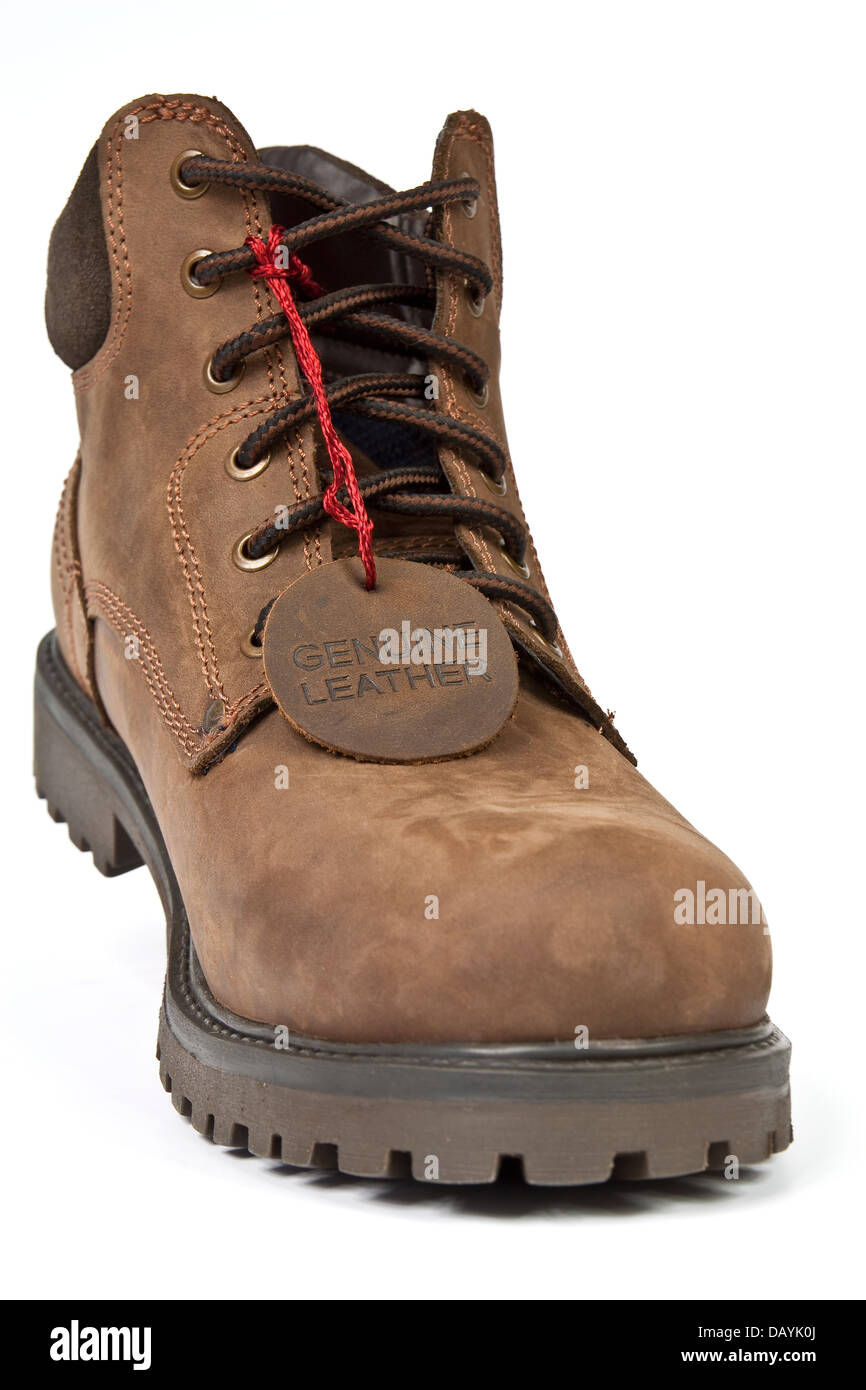 Mens brown leather boots with a red label strings Stock Photo - Alamy