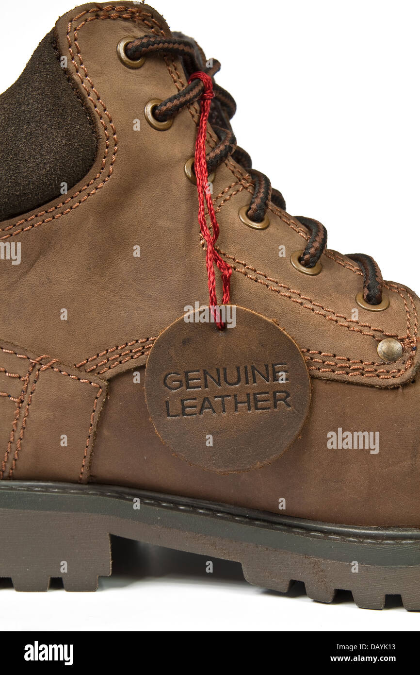 Mens brown leather boots with a red label strings Stock Photo - Alamy