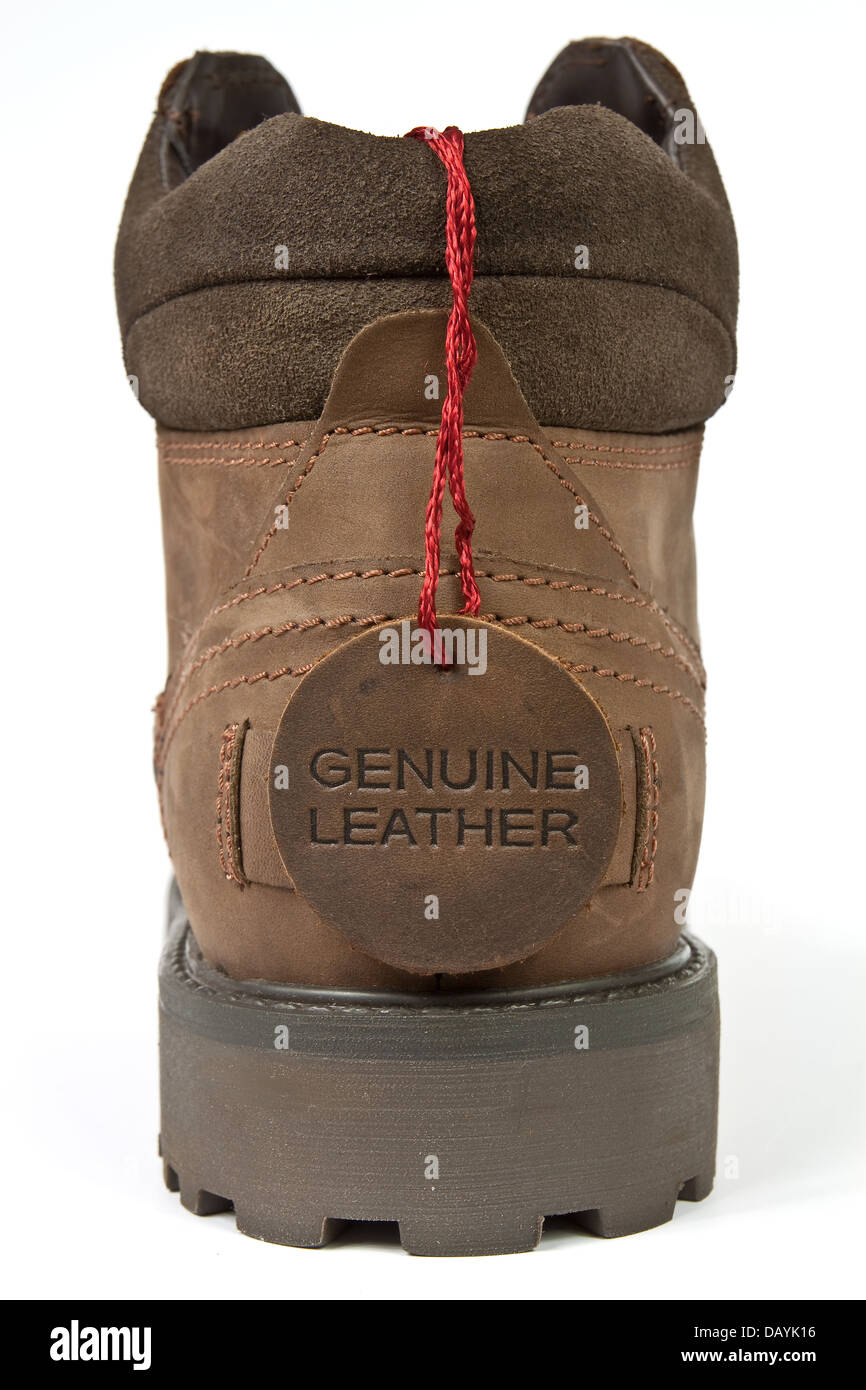 Mens brown leather boots with a red label strings Stock Photo - Alamy