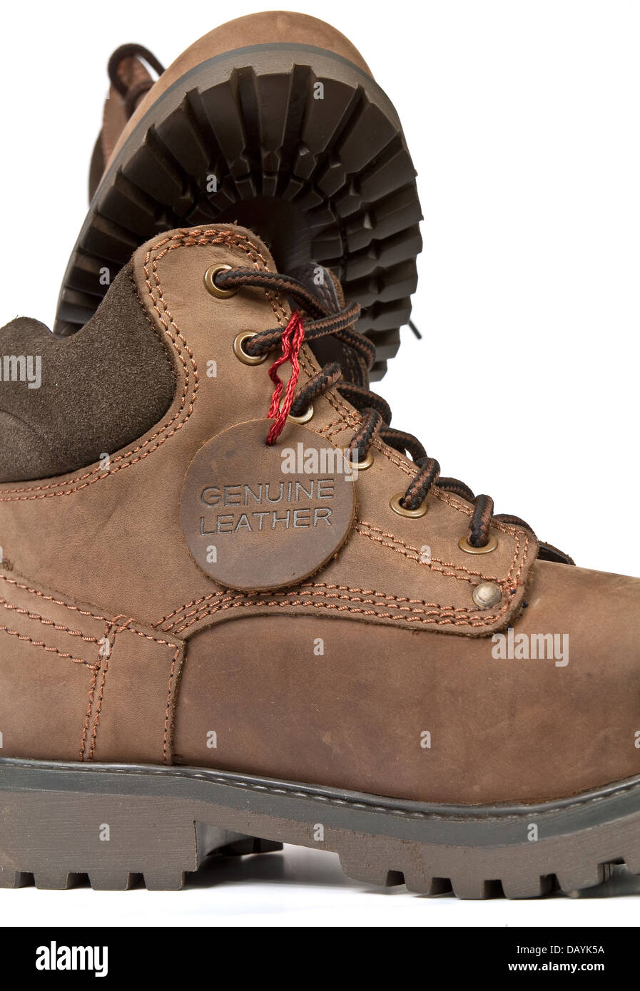 Mens brown leather boots with a red label strings Stock Photo - Alamy