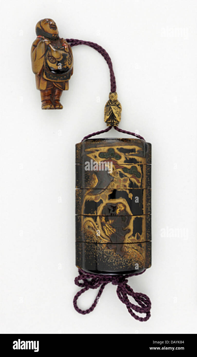 This inro set consists of a small container (inro) paired with an ojime ...