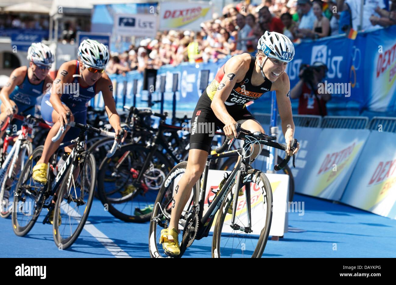 Triathlete Anne Haug (front) of Germany in action on her bicycle during ...