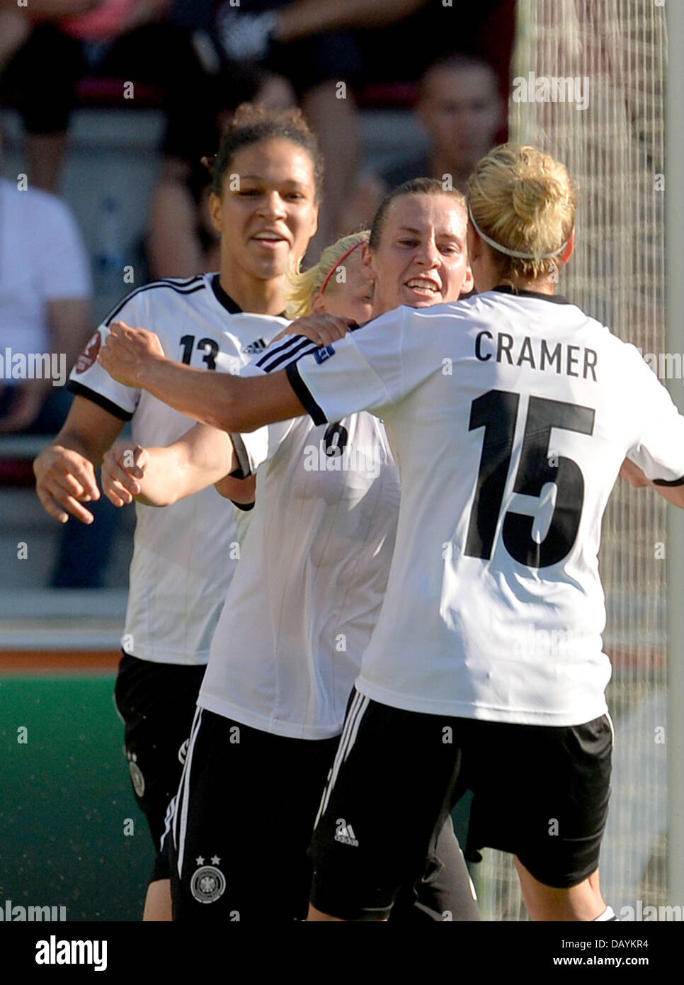 Simone Laudehr (C) celebrate her goal with Celia Okoyino da Mbabi and ...