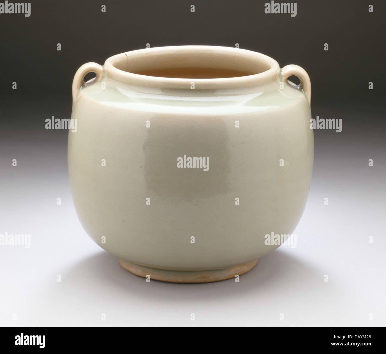 This Guan jar features two lug handles and is made from ceramic ...