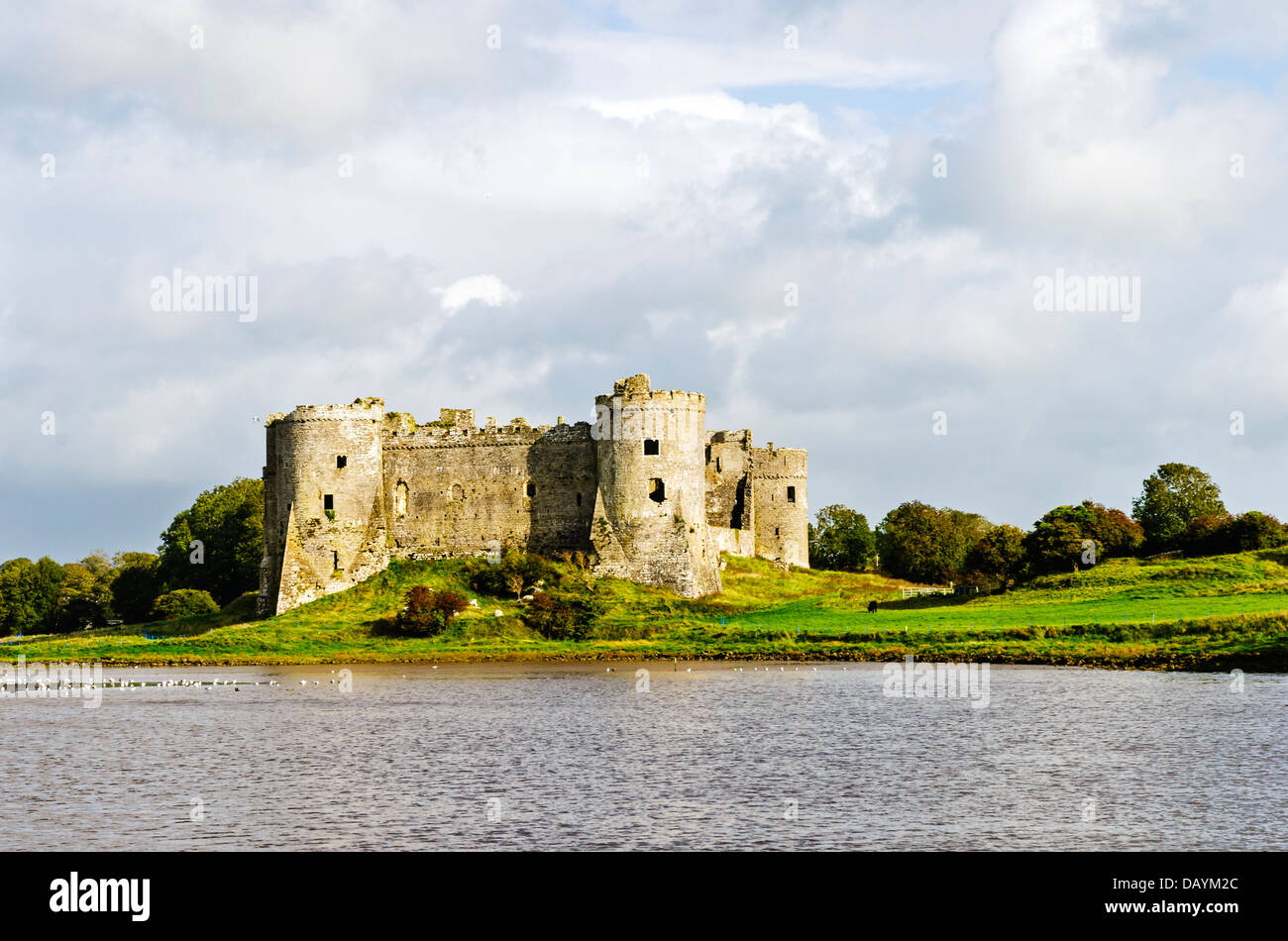 The West facade of the two large towers and high walls of Carew Castle ...