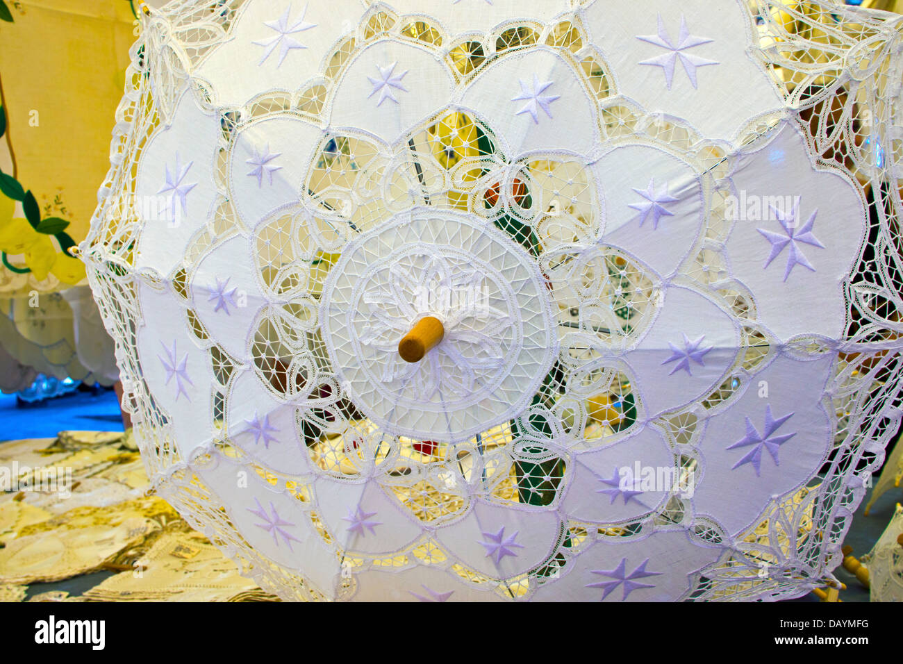 White lace parasol street shopping display Stock Photo - Alamy