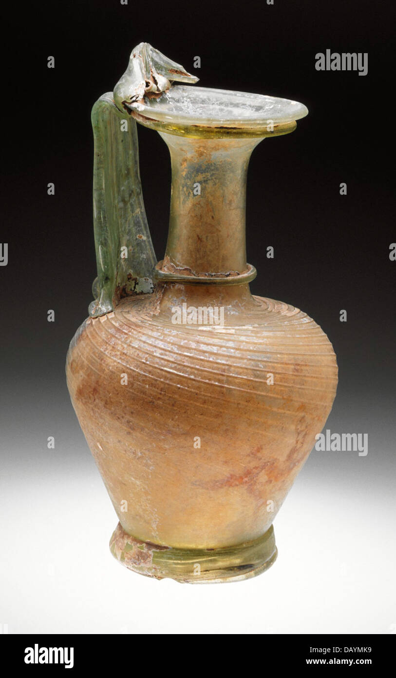 This ancient jug, made of ceramic, features a simple yet functional ...