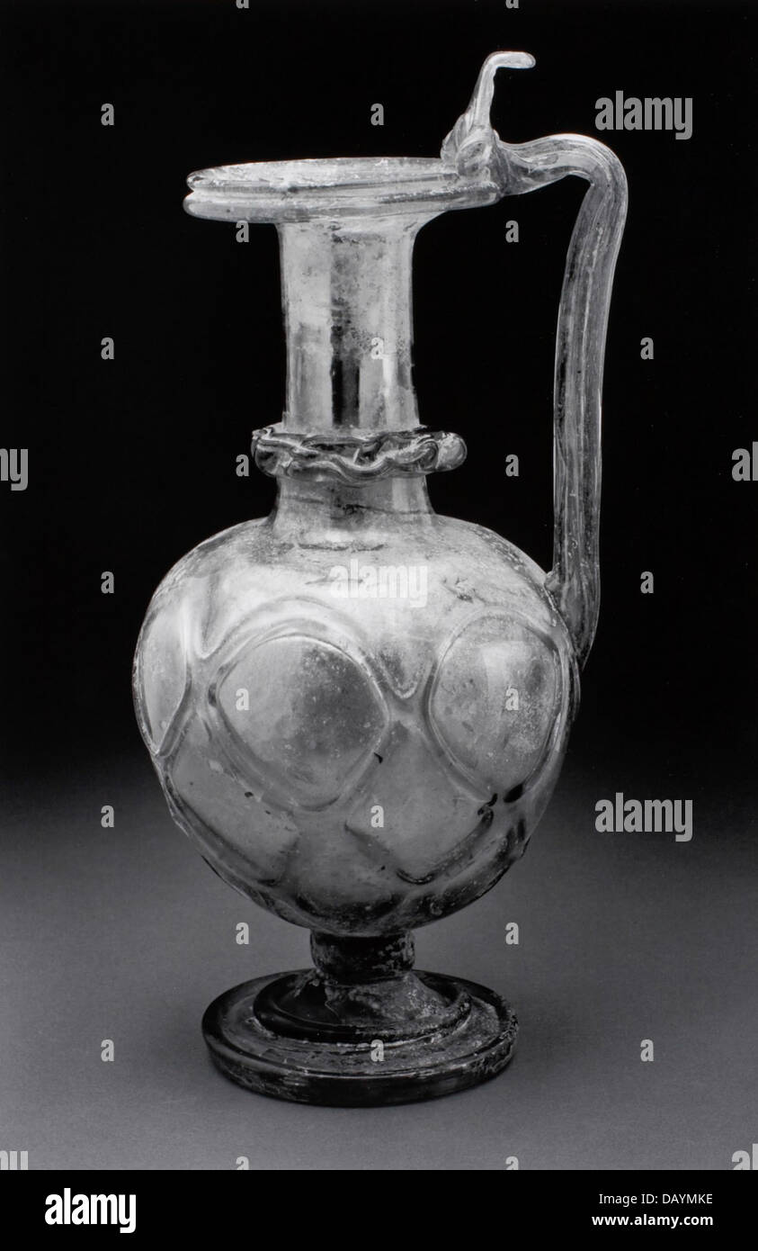 This ancient jug, crafted from ceramic, features detailed decoration ...