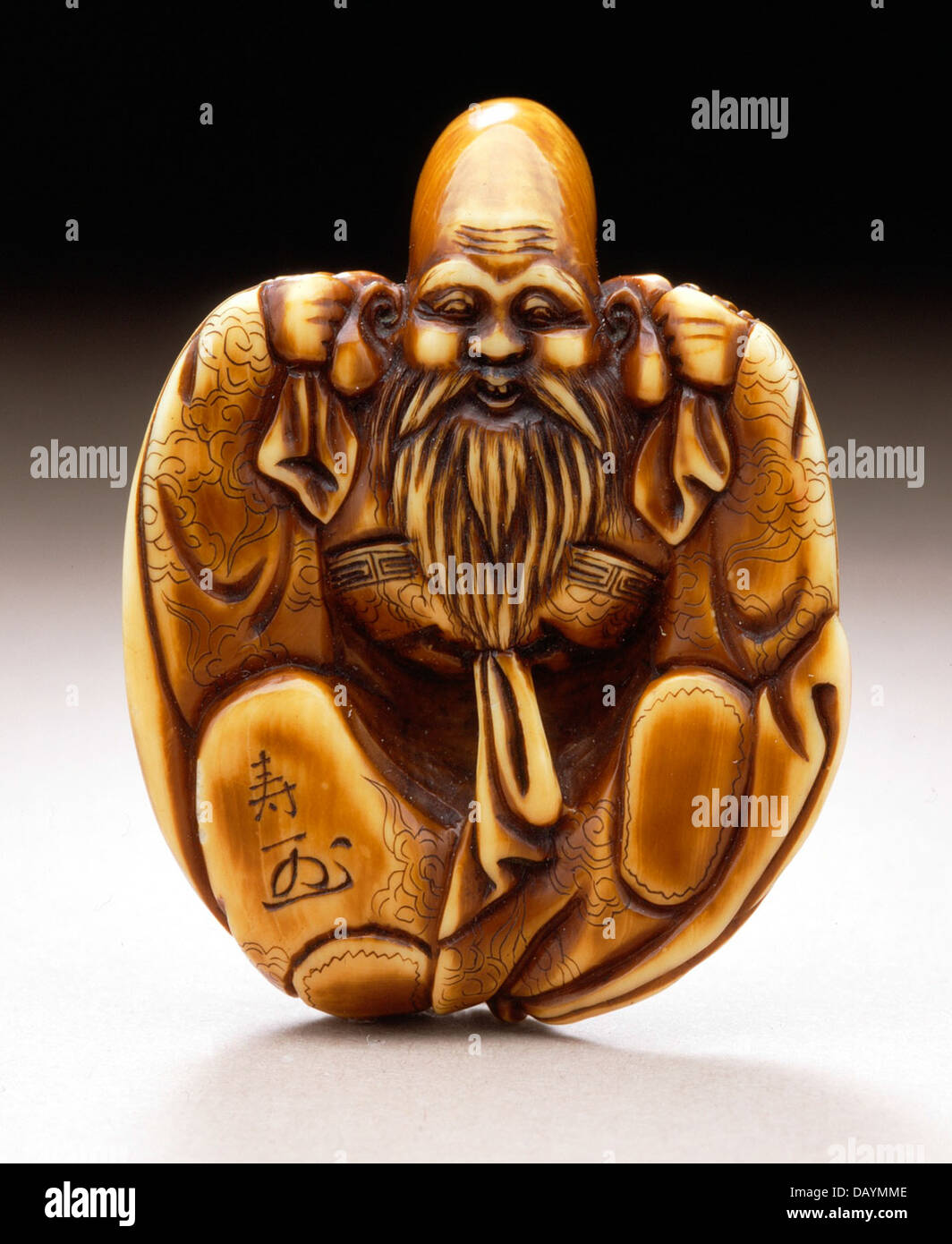 This sculpture depicts Jurojin, the Japanese god of longevity ...