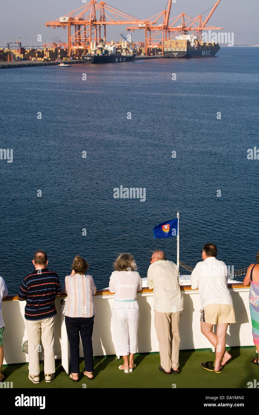 MS Dielmann passengers observe activities at Port Raysut, the sprawling ...
