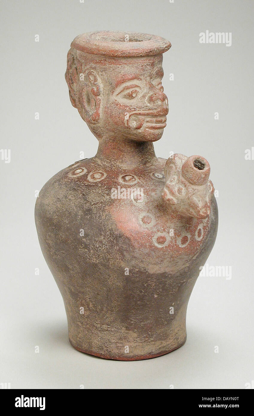 This ornate Kendi, made from ceramic, features intricate design and ...