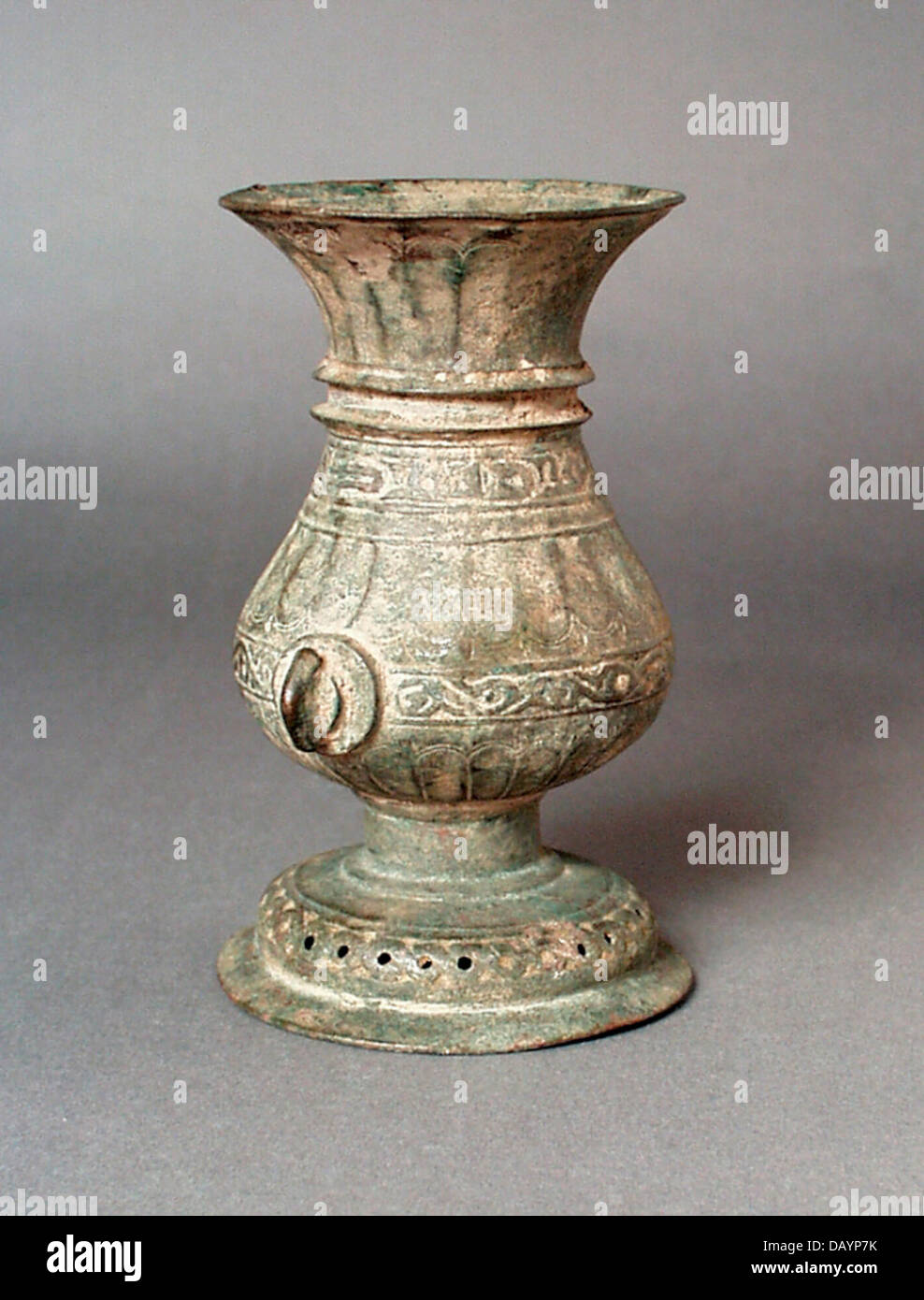 This lamp is an example of ancient craftsmanship, with an ornate design ...