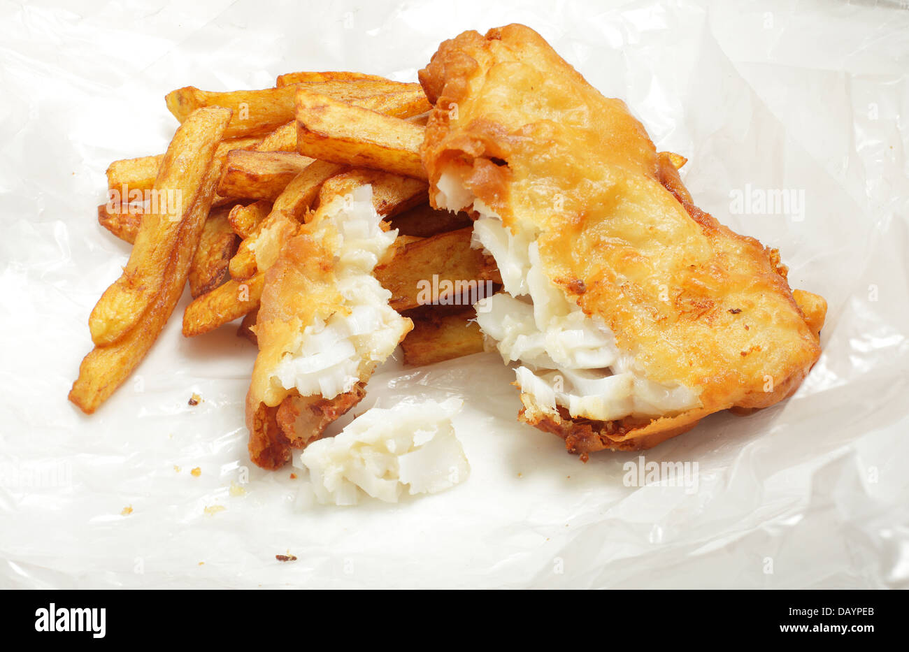 British "chip shop" style fried cod in batter with chips (french fries ...