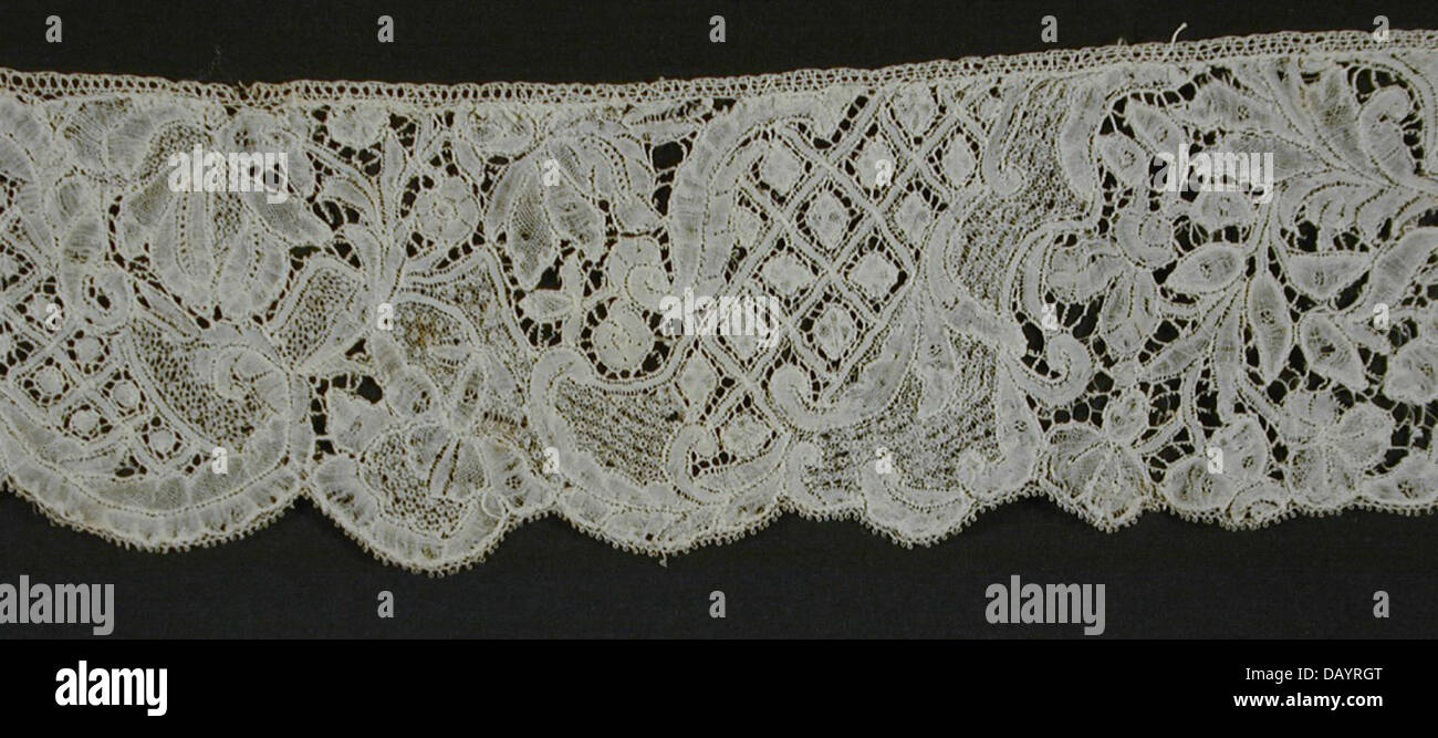 This delicate piece of lace, crafted from fine cotton, is a fine ...