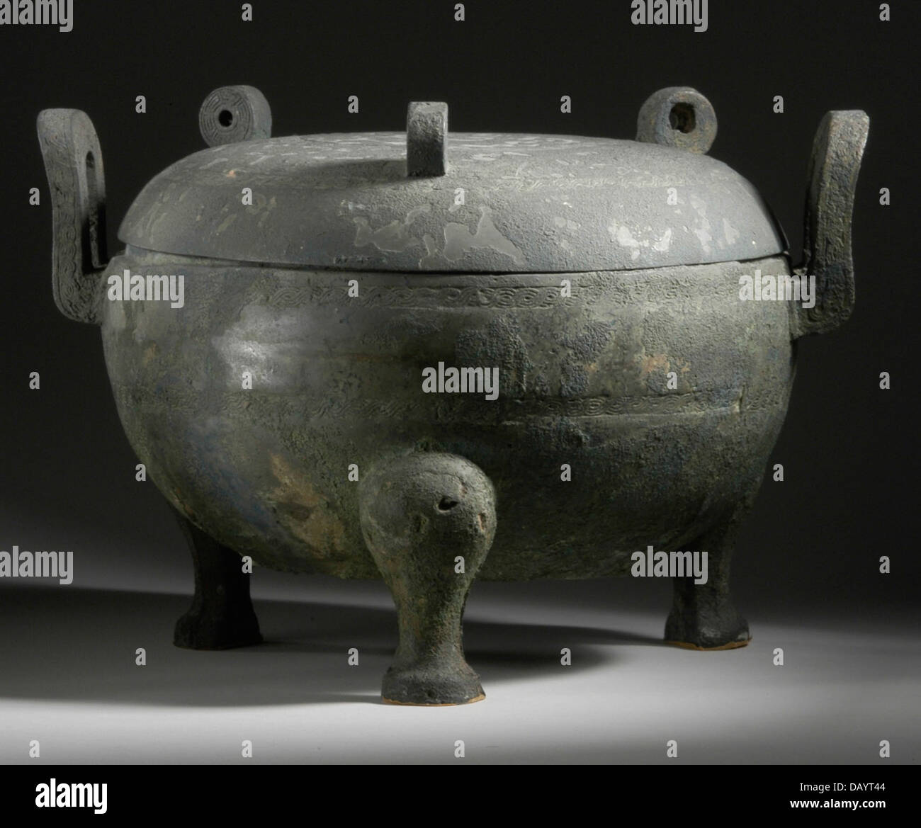 This lidded food cauldron, known as a Ding, is made from bronze and ...