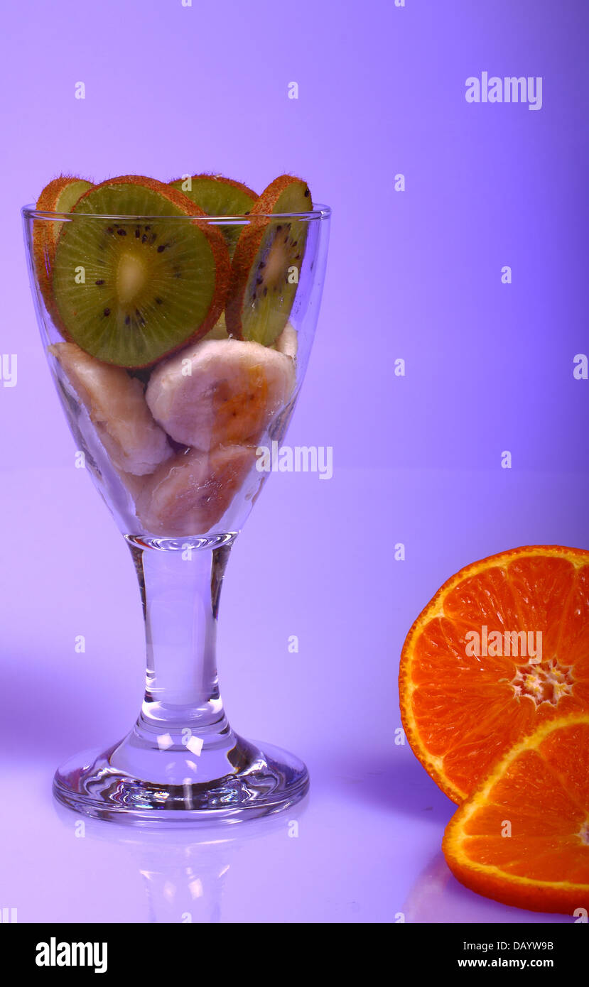 Fruit slices in a glass Stock Photo - Alamy