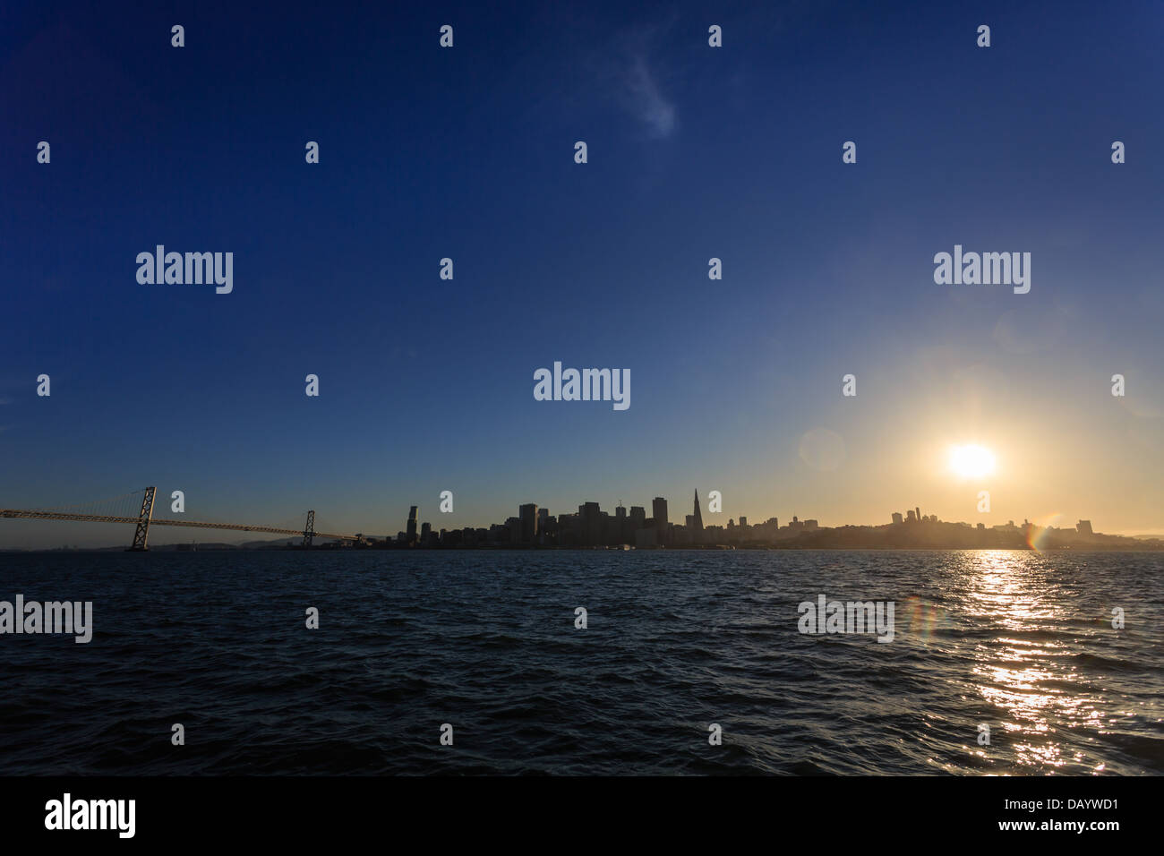 Sun Setting Behind San Francisco Skyline Stock Photo - Alamy