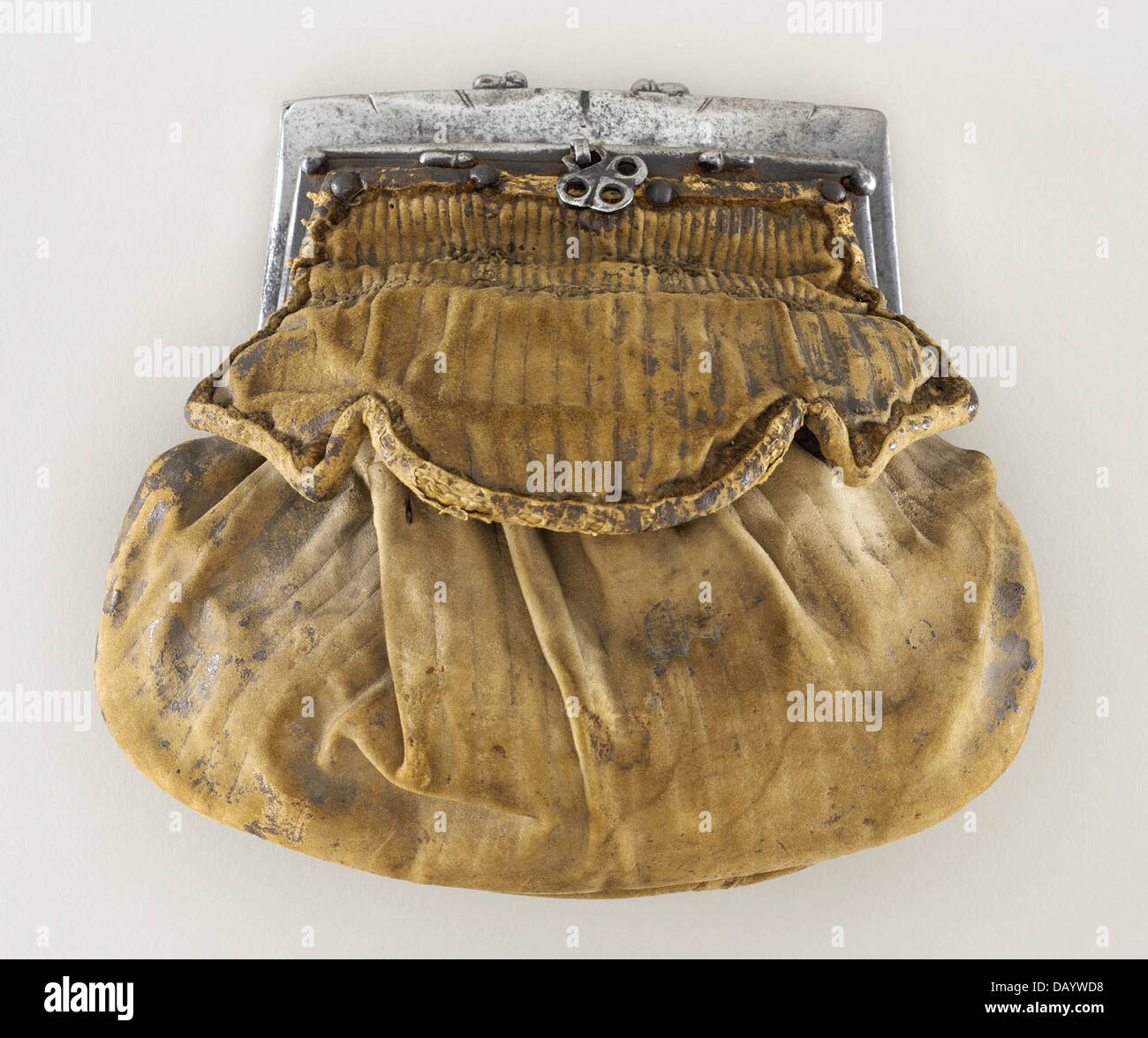 This historical man’s purse, crafted from intricate materials ...