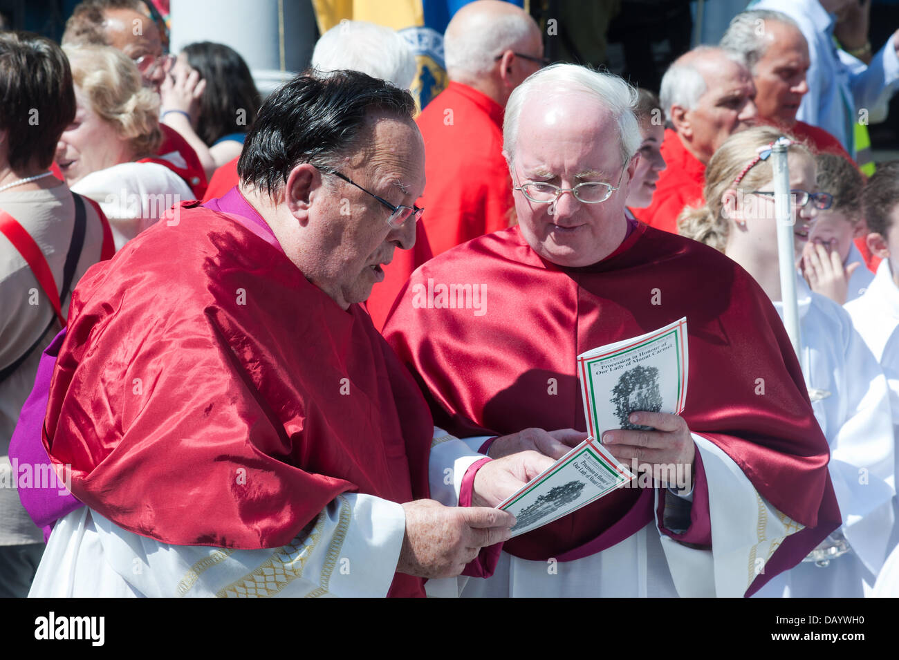 London, UK. 21st July, 2013. Two priests read a leaflet before the ...