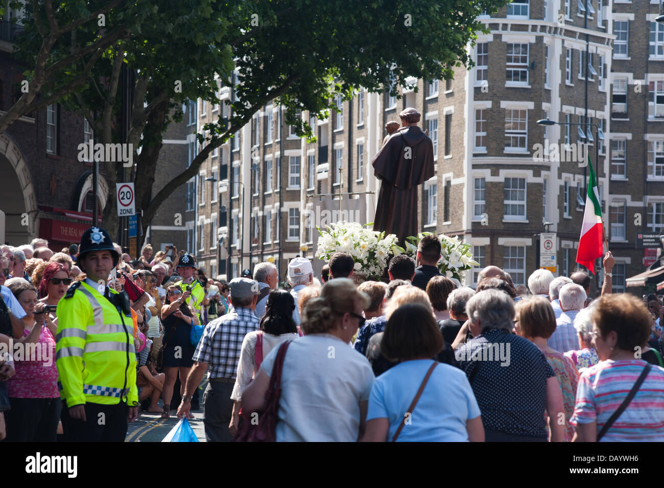 London, UK. 21st July, 2013. Religious statues are carried on wooden ...
