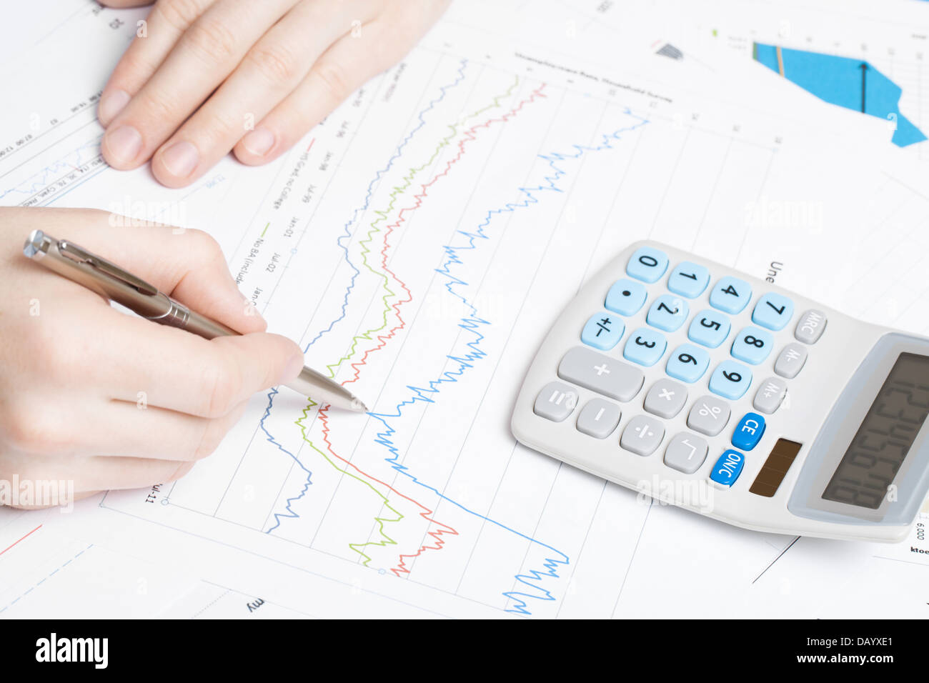 Man making financial calculations at the desk Stock Photo - Alamy