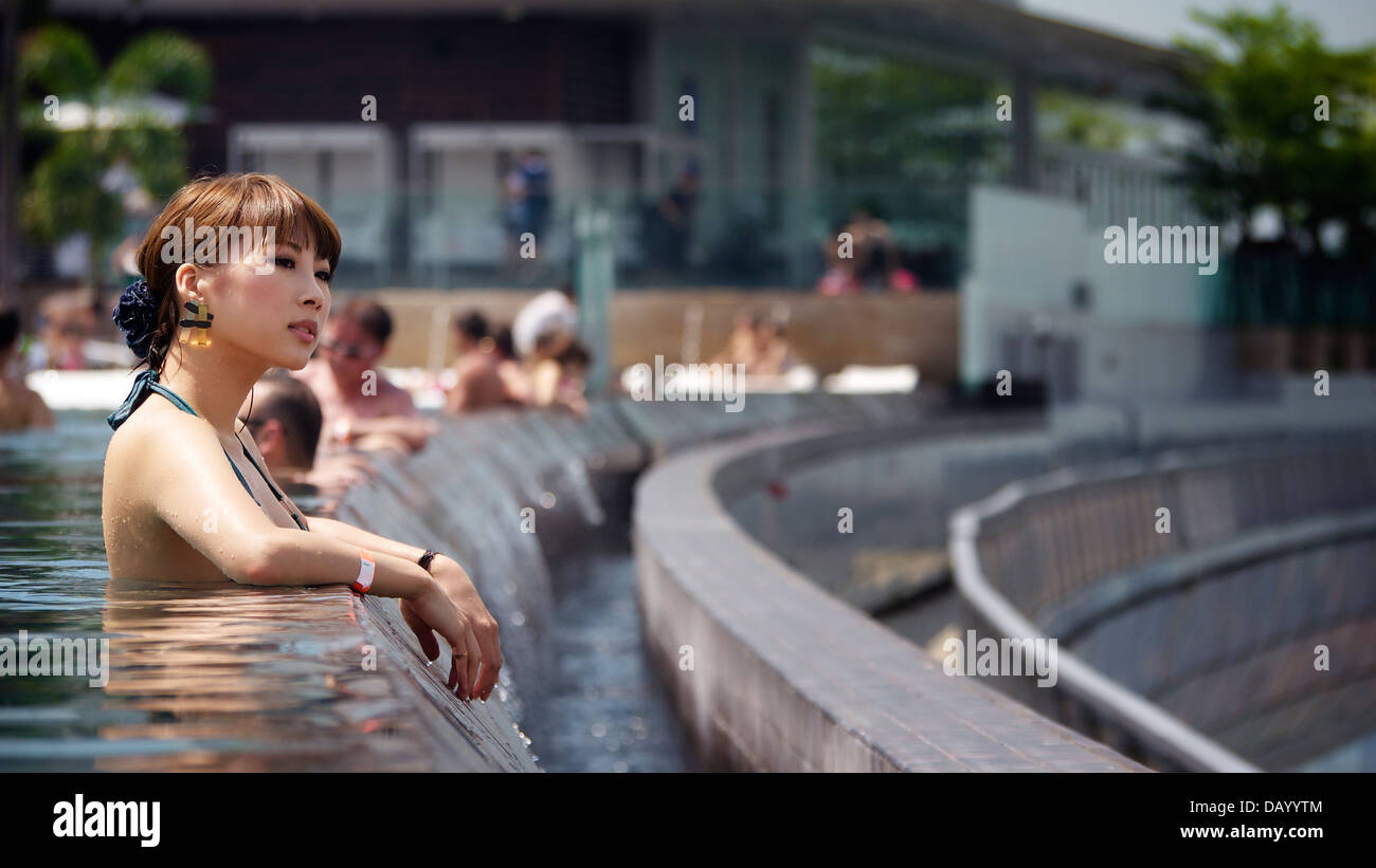 Pretty Japanese Tourist Staying at Marina Bay Sands soaking in the ...