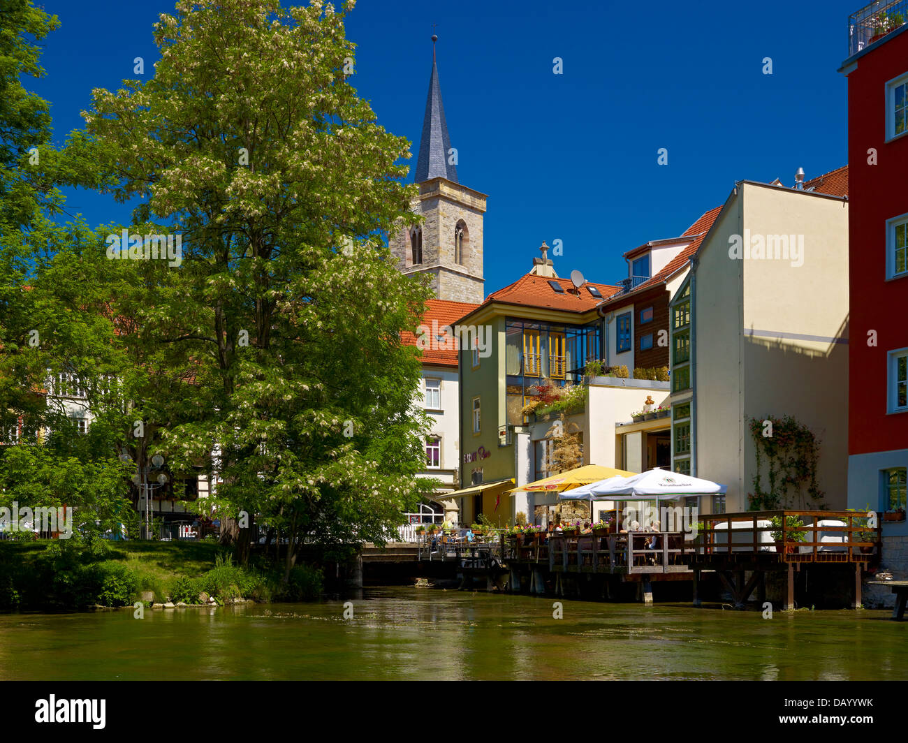 Outdoor cafes along gera river with st aegidien church hi-res stock ...