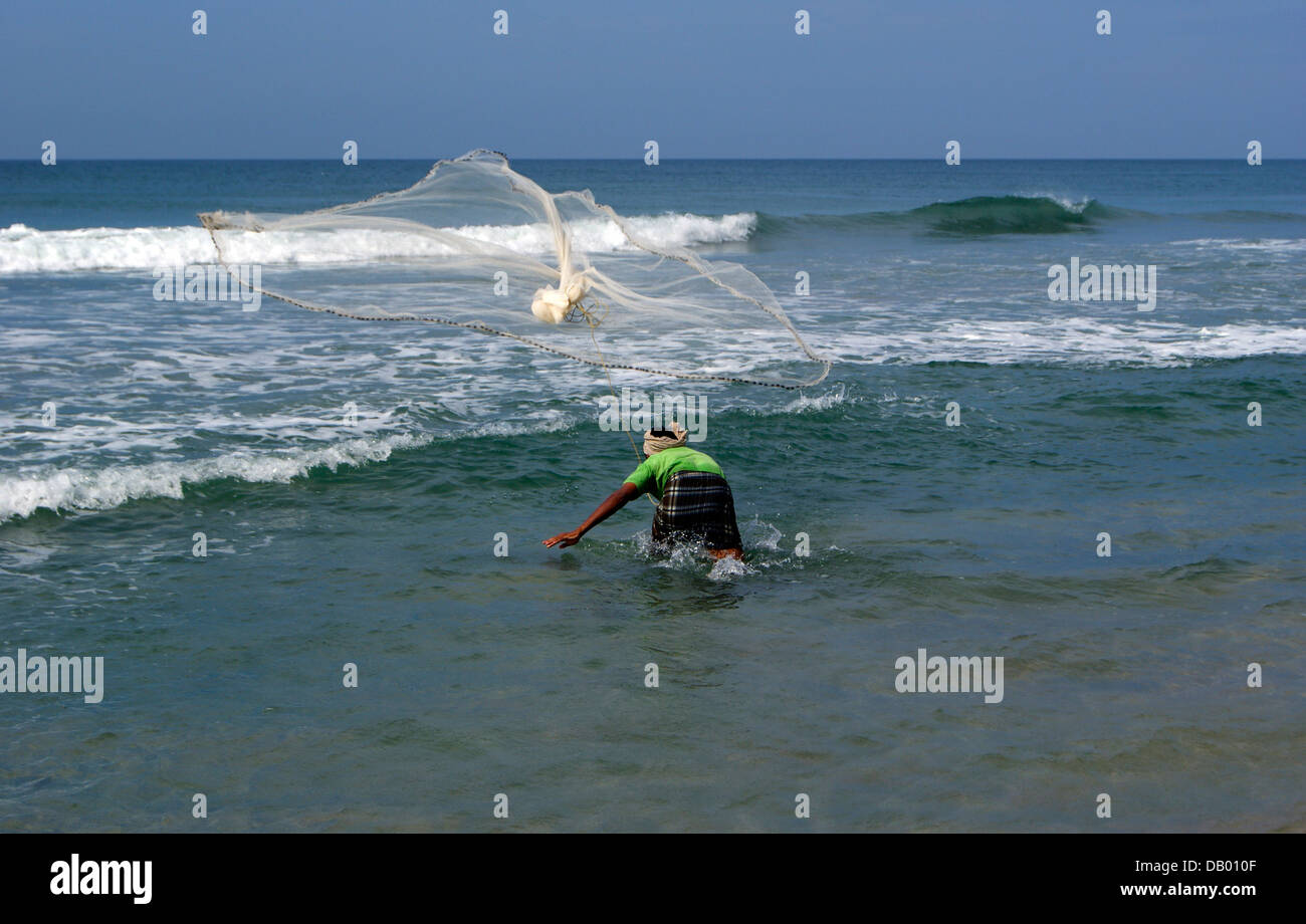 Fisherman Throwing Fishing Net on Arabian Sea at Kerala India Stock ...