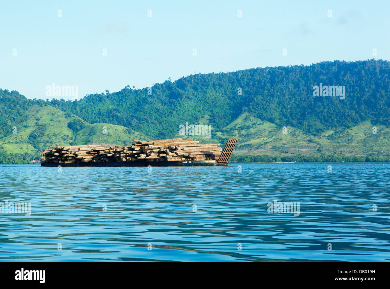 A Barge carts off rainforest timber from Borneo Stock Photo - Alamy