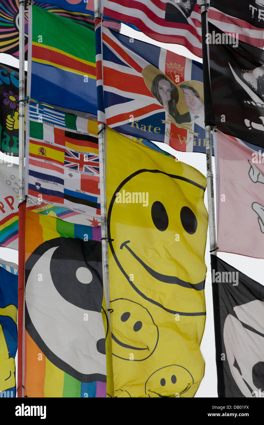 Assorted flags flying at a show ground in England Stock Photo - Alamy
