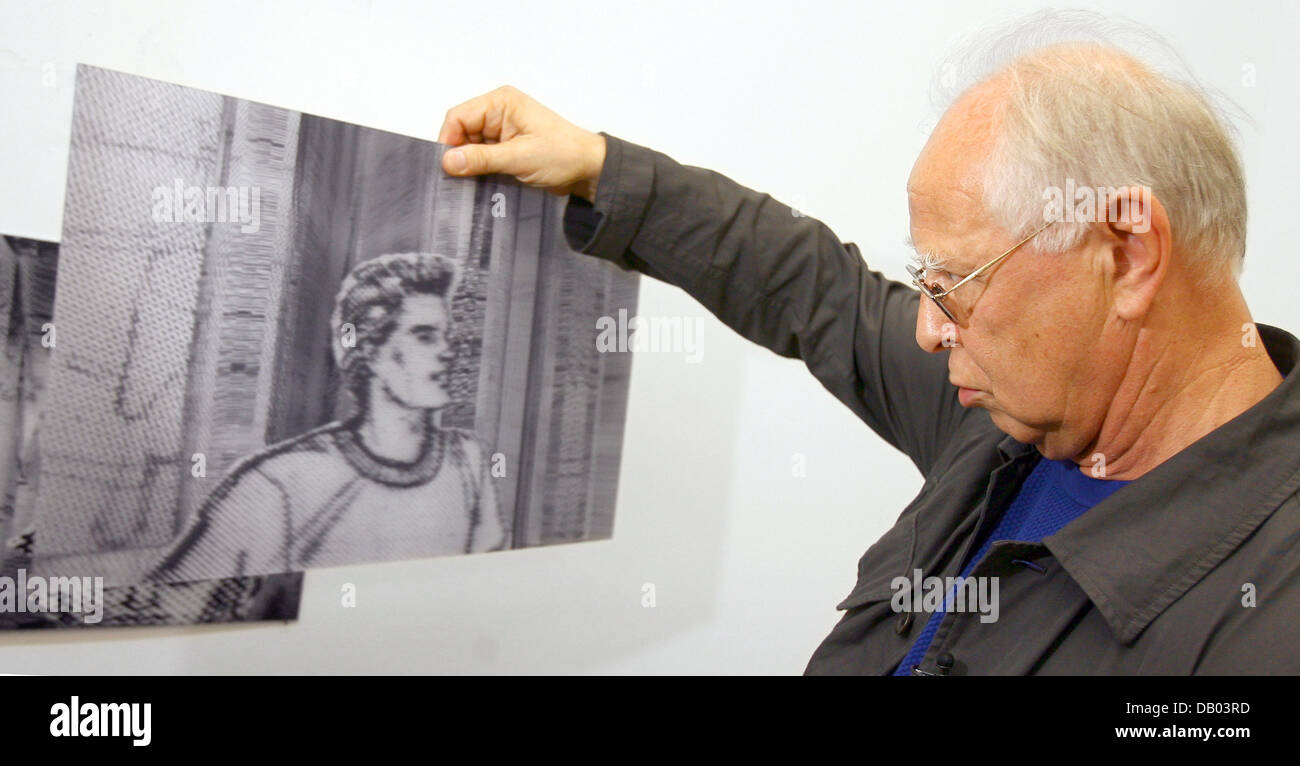 Painter Sigmar Polke takes a look at one of his untitled works in the ...