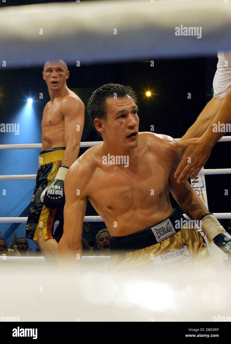Boxing pro Amin Asikainen (R) is on the floor during his fight against ...