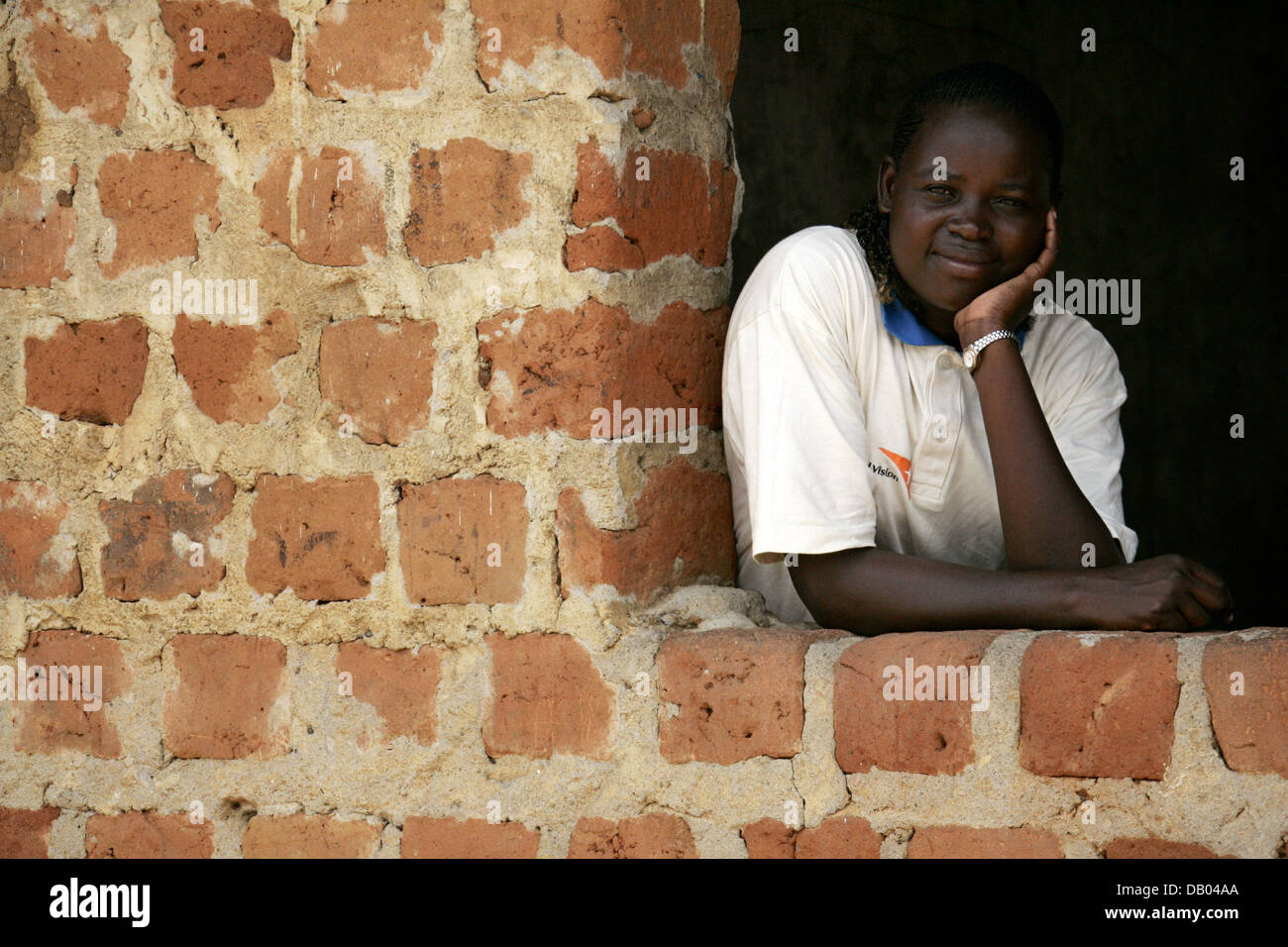 Former child soldier Hope is pictured in a window at a refugee camp ...
