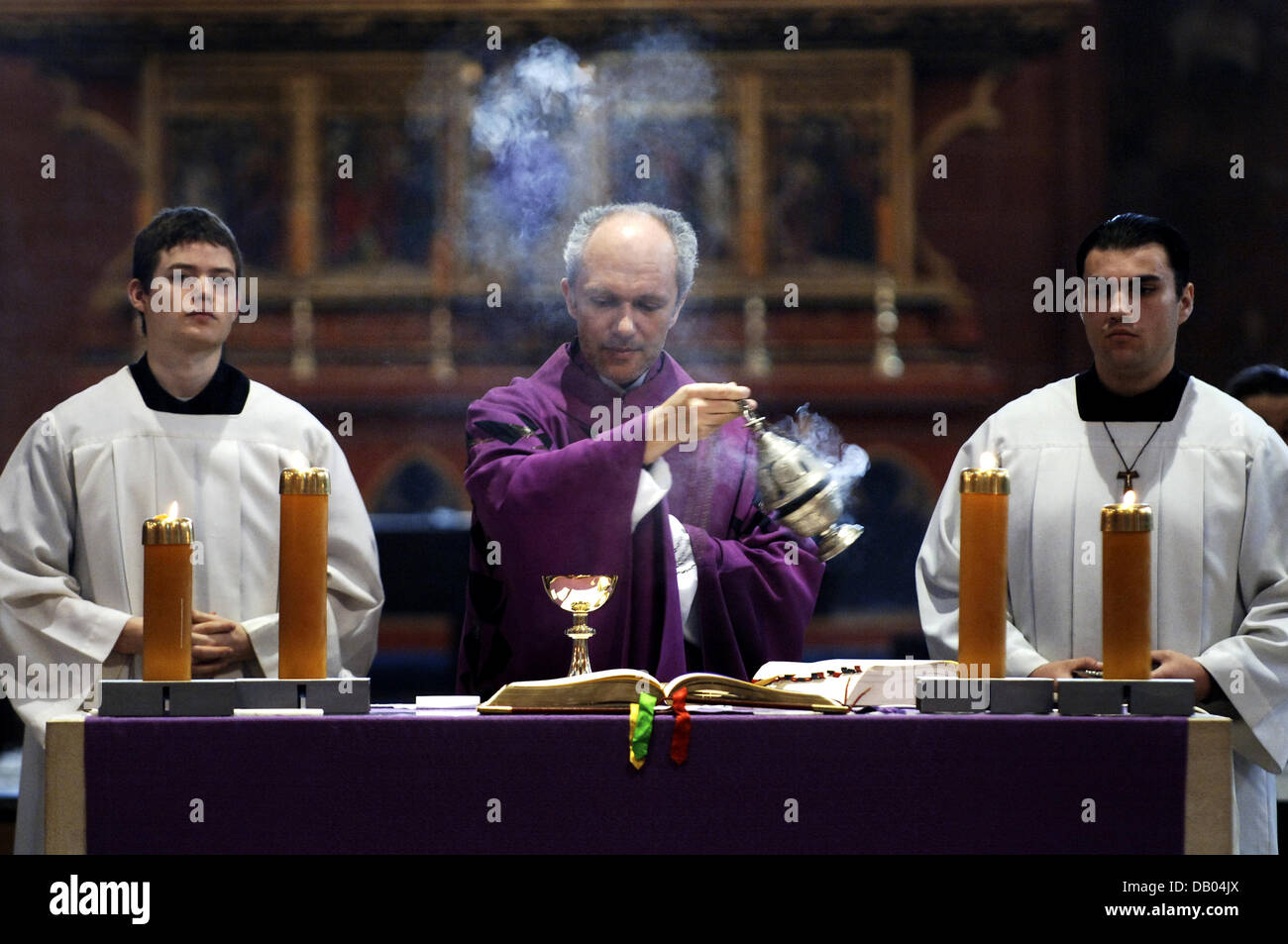 Priest Erich celebrates the Eucharist and burns incense in the ...