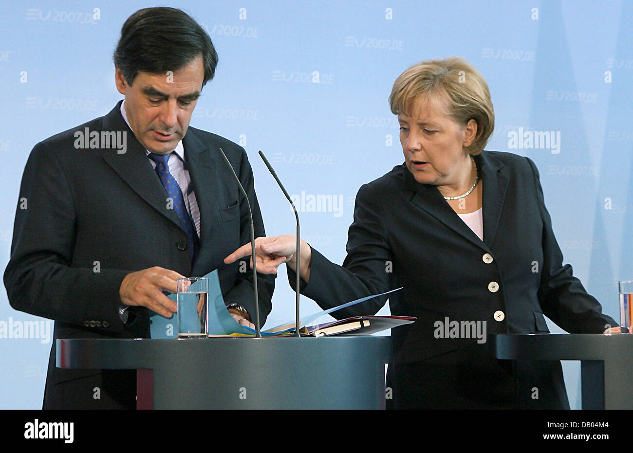 German Chancellor Angela Merkel points at French Prime Minister ...