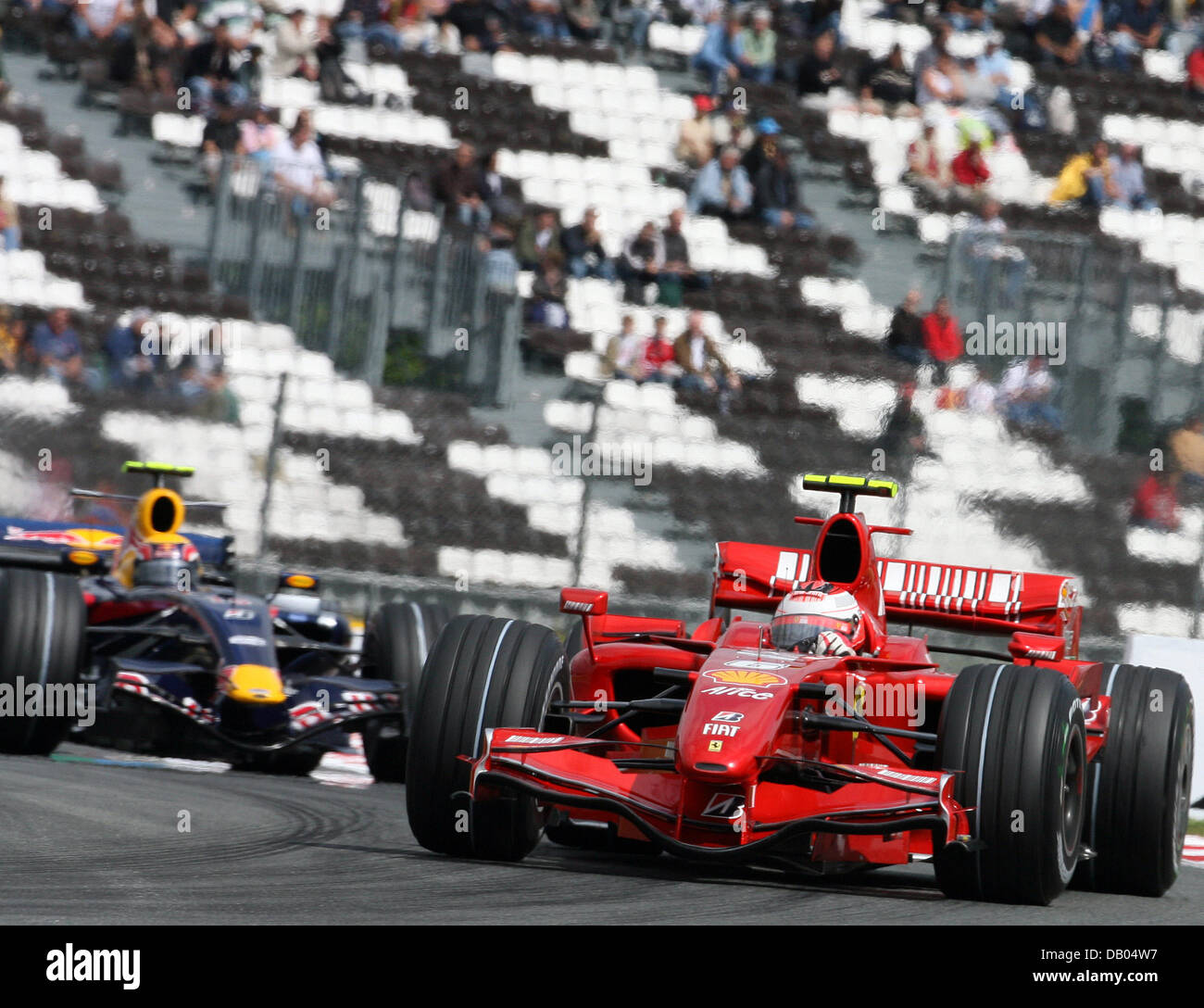 Finnish Formula One pilot Kimi Raikkonen (R) of Scuderia Ferrari ...
