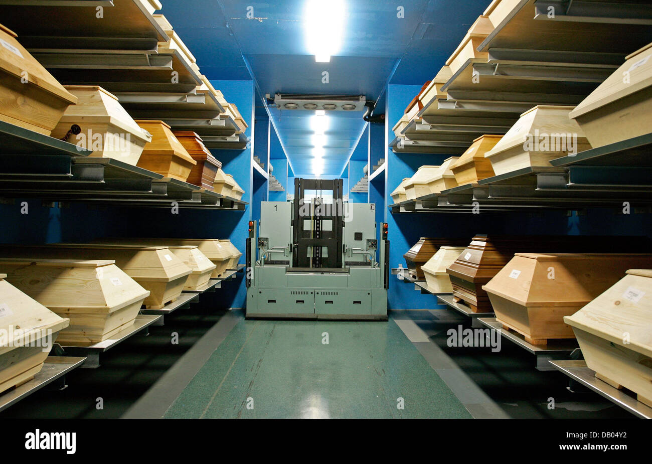 Coffins lie on shelves in the cooled storage room of Baumschulenweg ...