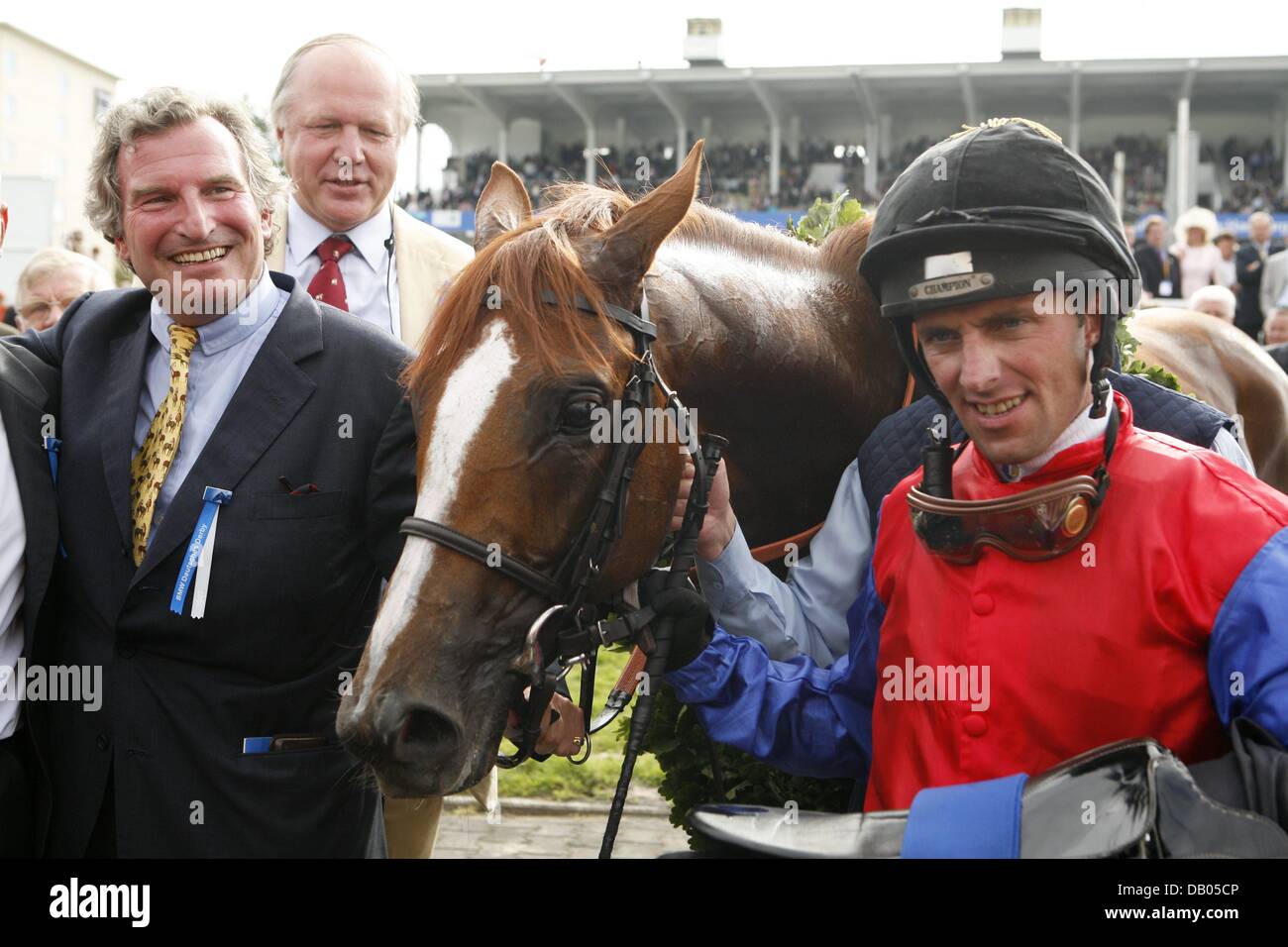 Georg Baron von Ullmann (L) and jockey Frederick Johansson (R) are ...