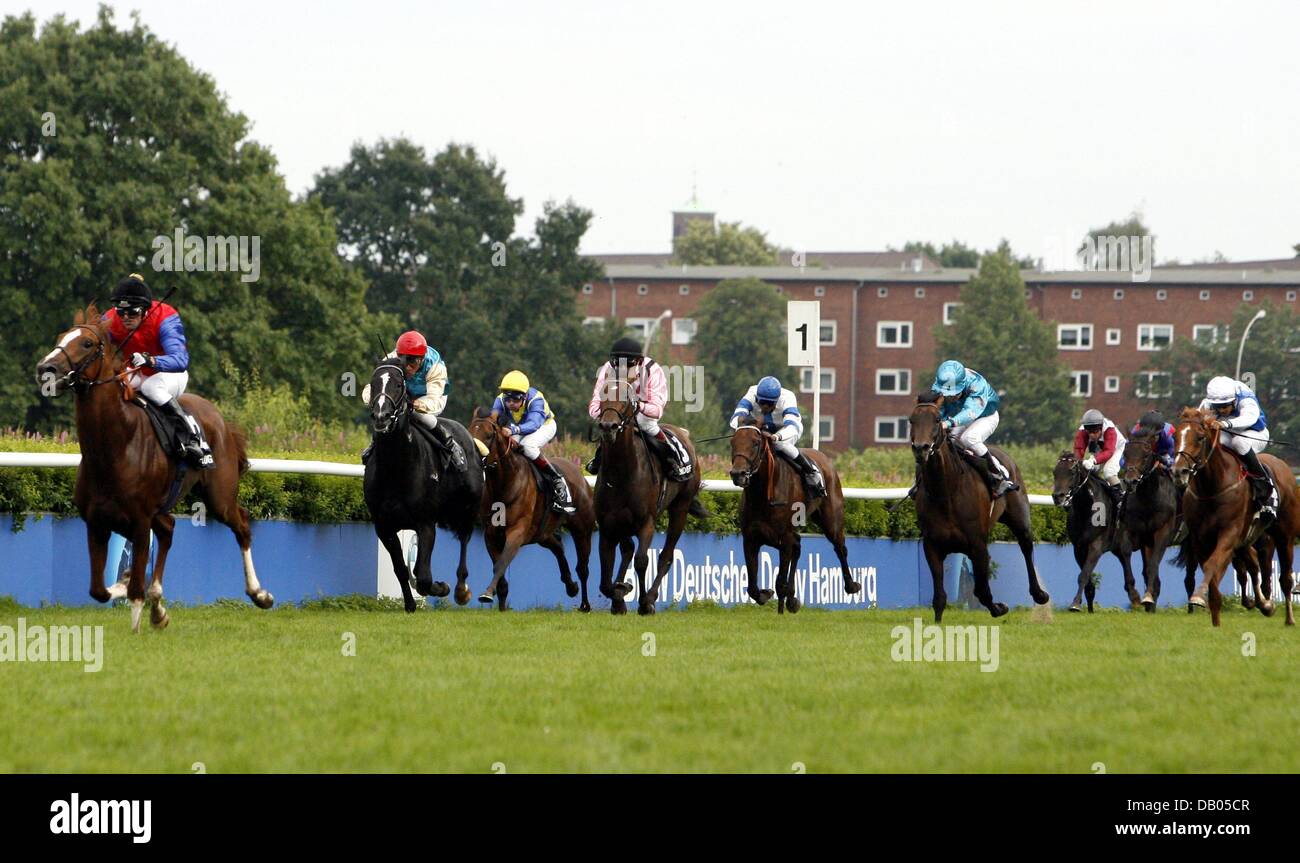 Jockey Frederick Johansson (L) on Adlerflug leads the race at the 138th ...