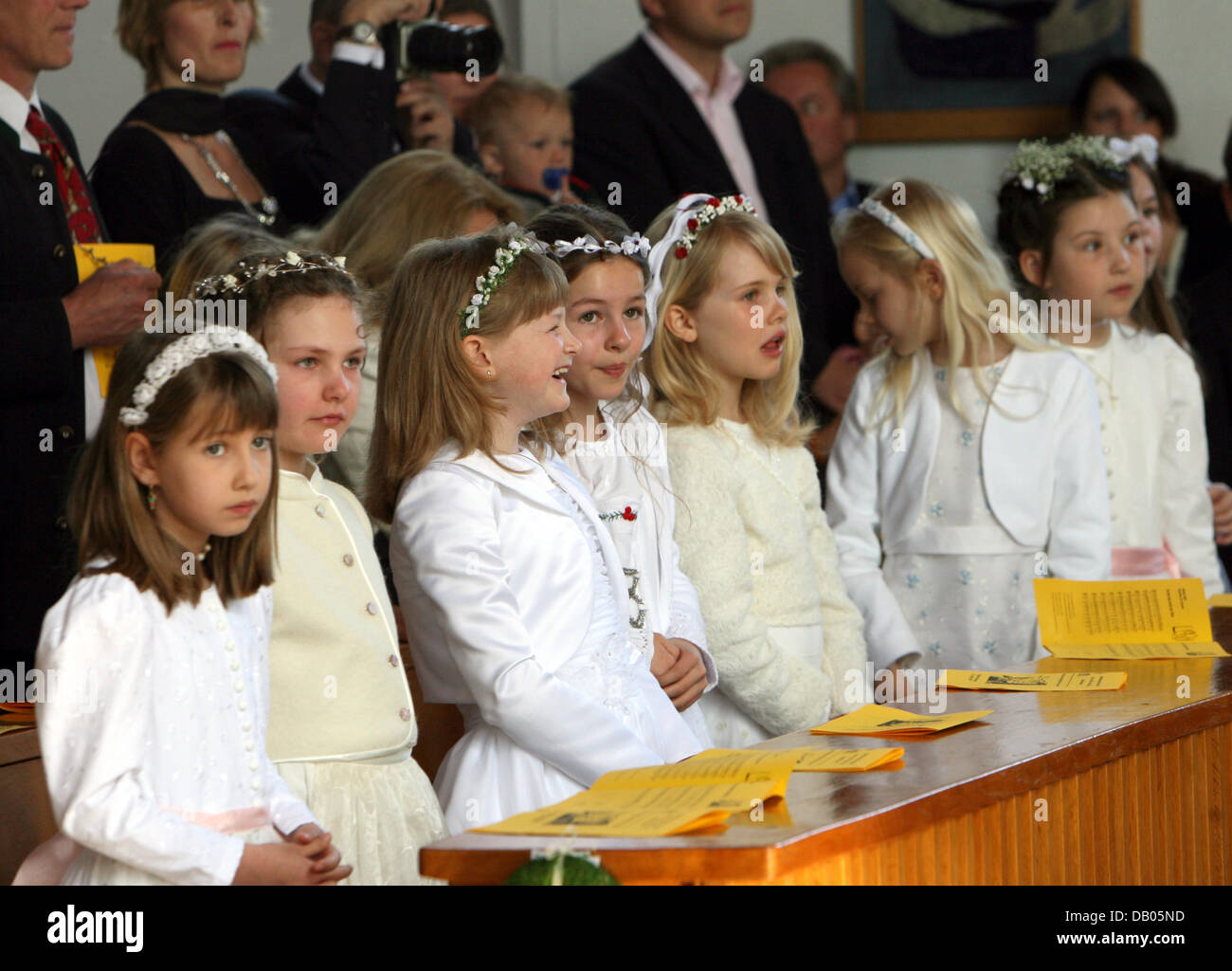 Girls shown at church during the First Communion ceremony at Catholic ...