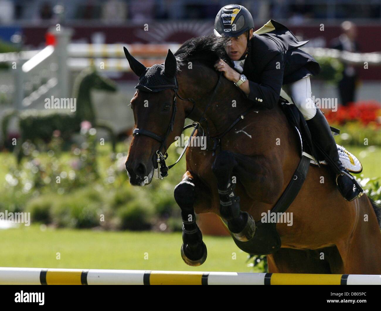 German equestrian Marcus Ehning and his horse 'Cinderella' take an ...