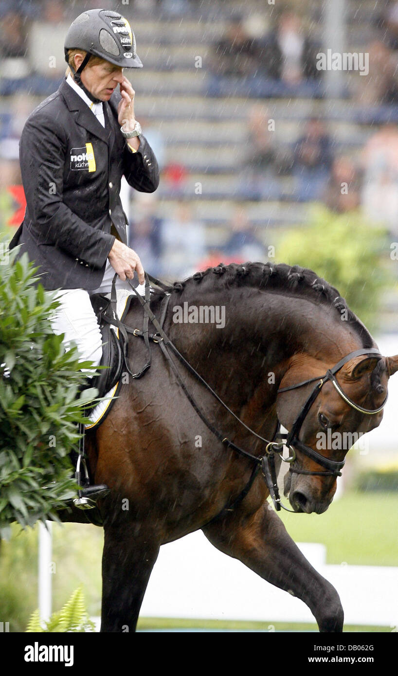 German equestarian Marcus Ehning and his horse 'Sandro Boy' are ...