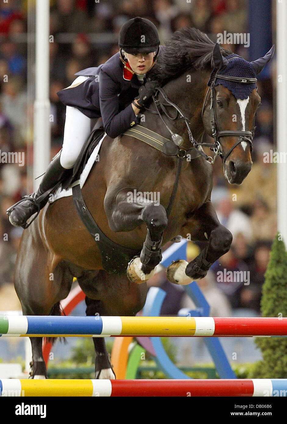 British equestrian Ellen Whitaker and her horse 'Locarno' take an ...
