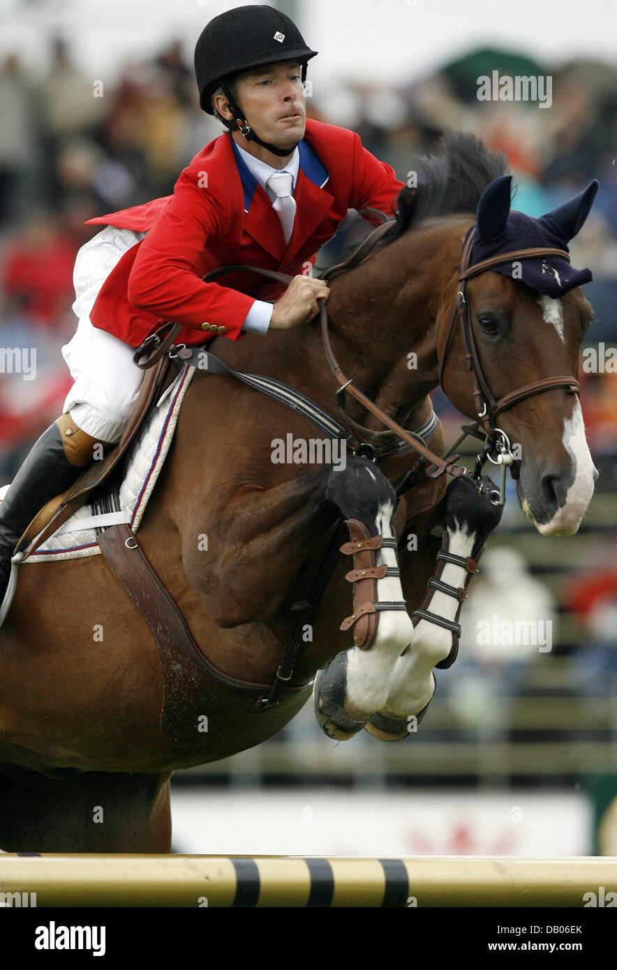 US equestrian Richard Spooner and his horse 'Cristallo' take an ...