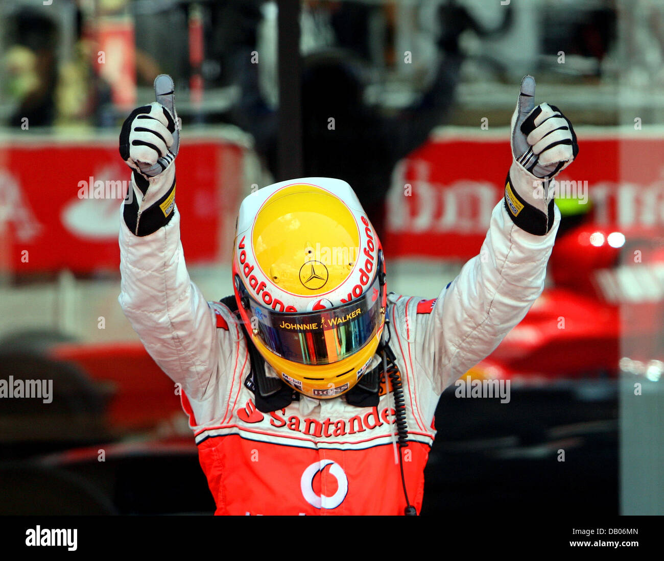 British Formula One driver Lewis Hamilton of McLaren Mercedes cheers ...