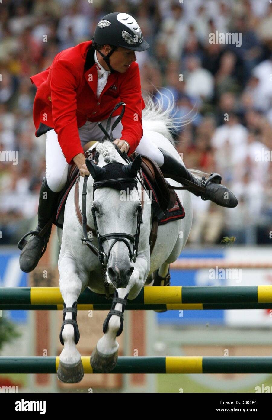 German rider Christian Ahlmann jumps over the last obstacle on Coester ...