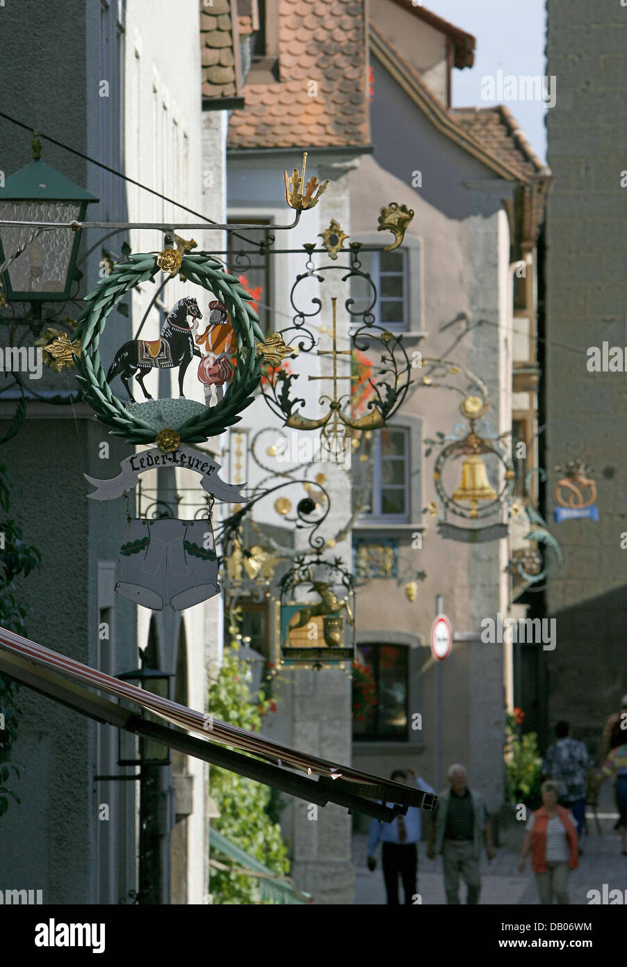 The picture shows an old store sign made of iron which is typical for ...