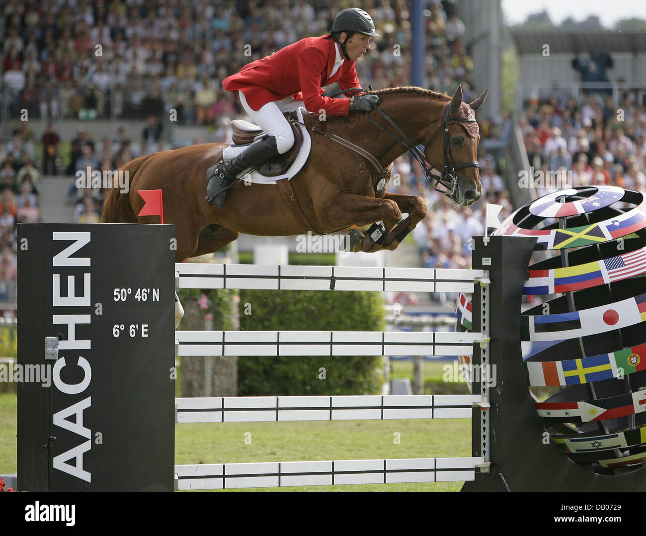 German equestrian Ludger Beerbaum and his horse 'Goldfever' take an ...