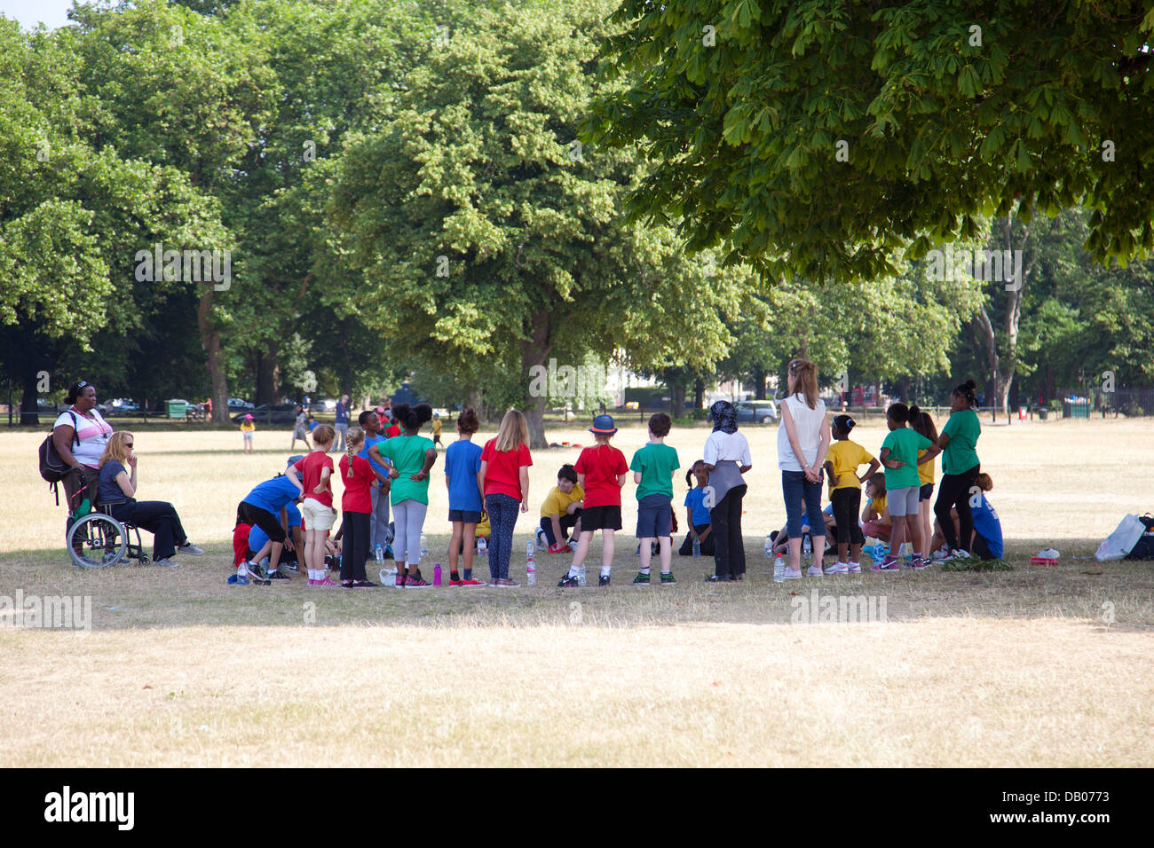 Group Of Kids in Circle Activity under Shade of Tree in Park - Clapham ...