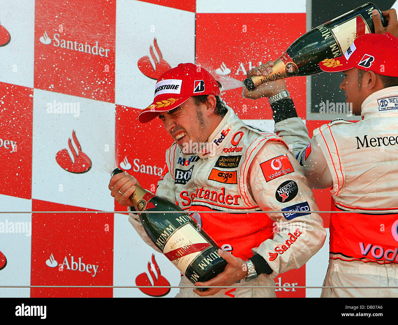 Spanish Formula One pilot Fernando Alonso (L) of McLaren Mercedes is ...
